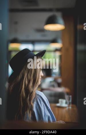 Beautiful Bosnian Caucasian woman in gray coat looking at the camera ...