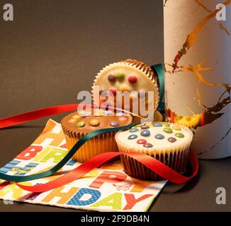 Delicious birthday cupcakes on table on bright background Stock Photo ...