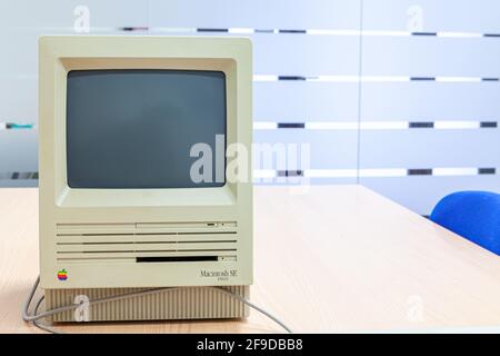 Apple workstation, antigue model of macintosh in a office background ...