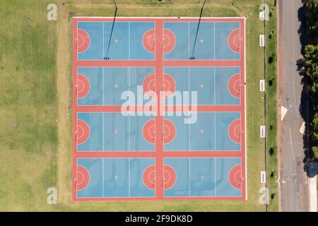 Drone aerial photograph of colourful netball courts and large sports ...