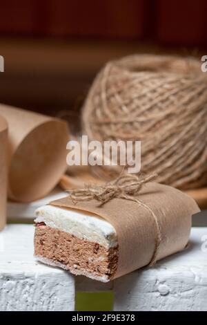 Portion marshmallow with cocoa and cranberries. Wrapped in paper and ...