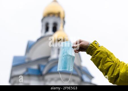 A protective mask in the background of the Christian church during the ...