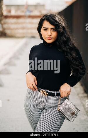 Positive male hipster with arm prosthesis messaging on social media via ...