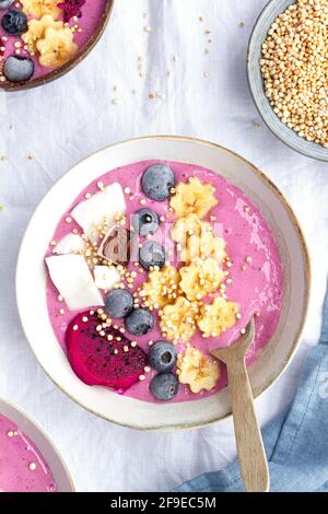 A top view of banana slices and shiny Blueberry on white plate Stock ...