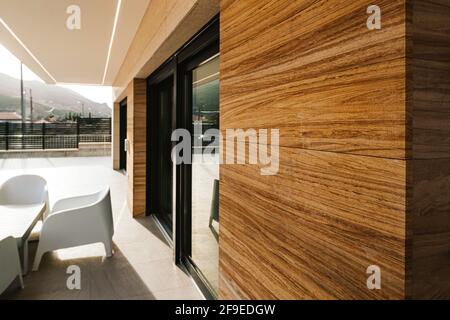 Modern building facade with rectangular shaped ornament on wooden wall ...