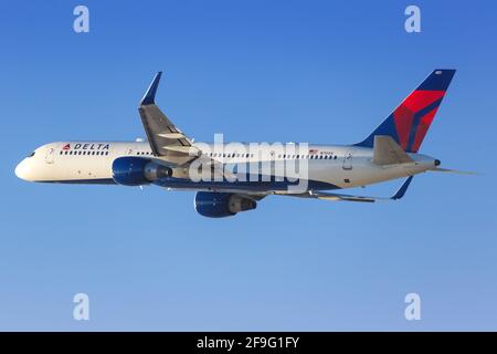 Delta Airlines Boeing 757 at LAX airport connected to jet bridge aerial ...
