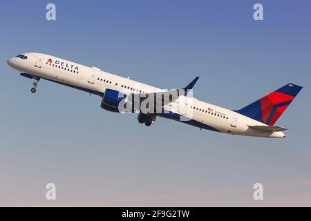 Delta Airlines Boeing 757 at LAX airport connected to jet bridge aerial ...