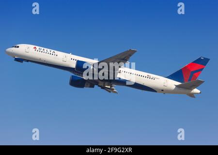 Delta Airlines Boeing 757 at LAX airport connected to jet bridge aerial ...