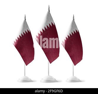 Small national flags of the Qatar on a light blurry background Stock ...