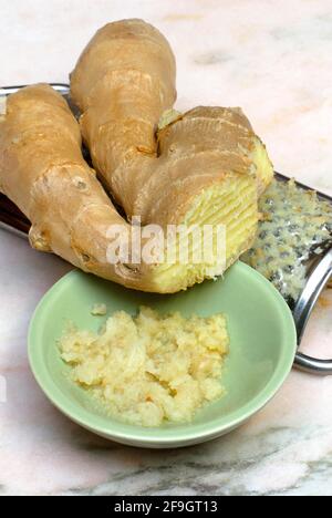Grated ginger, grater and root ginger Stock Photo - Alamy