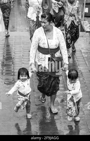 A Balinese Hindu Family Arrives At The Batara Turun Kabeh Ceremony in ...
