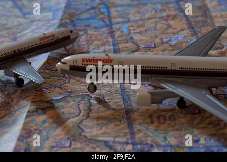 Aircraft toys on an air navigation map and golden captain stripes 25.3. ...