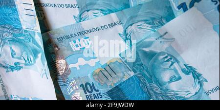 A closeup shot of a Brazilian real bill in the glass bank Stock Photo ...