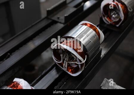 The stator of an industrial electric motor at the assembly stage. Thick ...