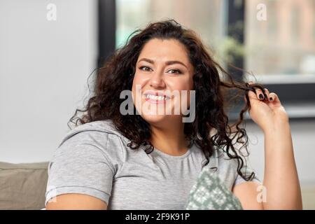 Plus size hispanic woman playing piano at music studio showing and ...