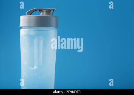 Shaker is an empty plastic smoothie cup on a blue background. Free ...