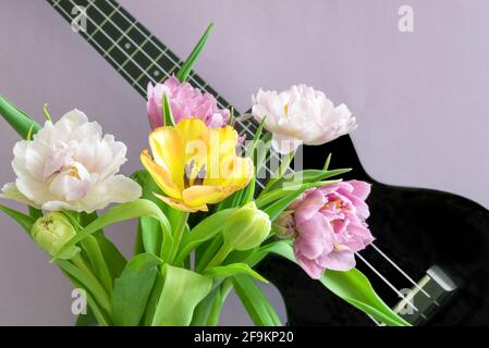 Colorful ukulele on red background, top view. String musical instrument ...