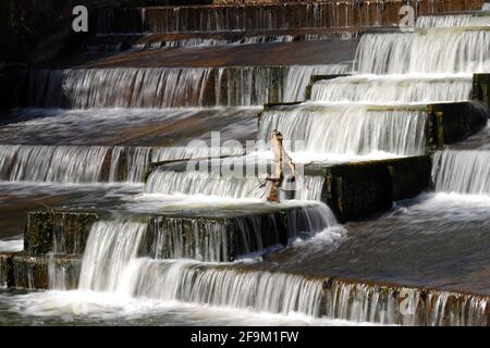 Water cascades as it flows along Scalby Beck and out into the North Sea ...