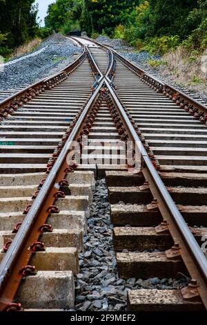 Two tracks diverging Stock Photo - Alamy