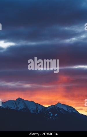 mountains colored purple at dusk Stock Photo - Alamy