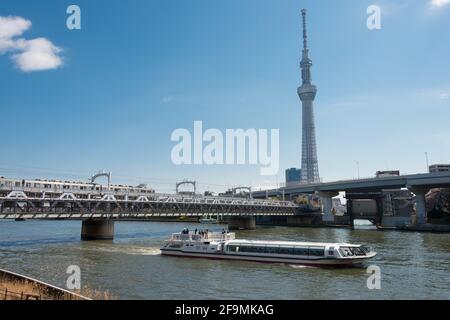 Skytree, a water bus and Sumida River Stock Photo - Alamy