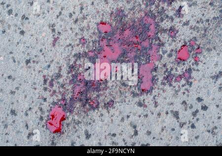 A pool of blood on the asphalt. Splattered human blood on the road. Top ...