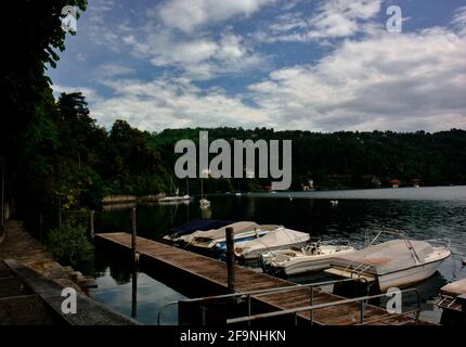 Lake Orta with boats by the port Stock Photo - Alamy
