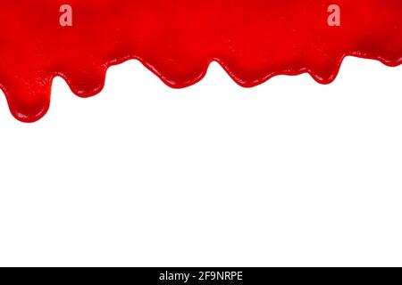 Red ketchup dripping on white background close-up Stock Photo - Alamy