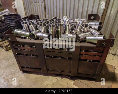 shiny steel parts overflowing big intermodal steel container box on ...