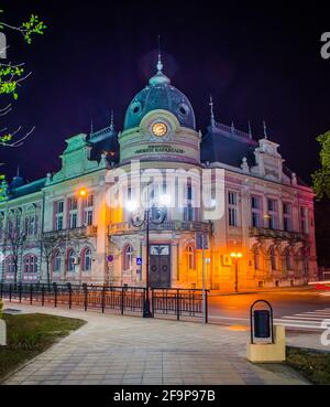 night view of the illuminated building of rousse - ruse municipality in ...