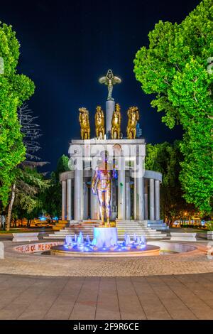 night view of the monument of fallen heroes in macedonian capital ...