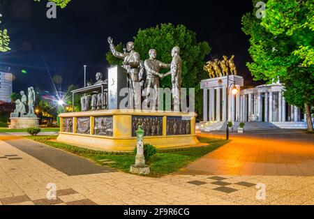 night view of the monument of fallen heroes in macedonian capital ...