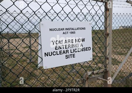 Security fence of a nuclear power station with radioactivity warning ...