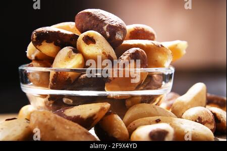 Composition with a bowl of shelled brazil nuts. Delicacies Stock Photo ...