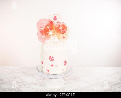 Baking tall round cake with large lollipops for a little girl's ...