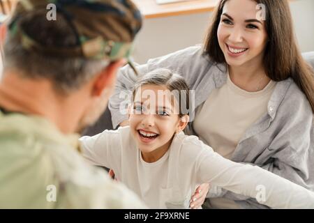 Happy military mom returning home to her children after deployment ...