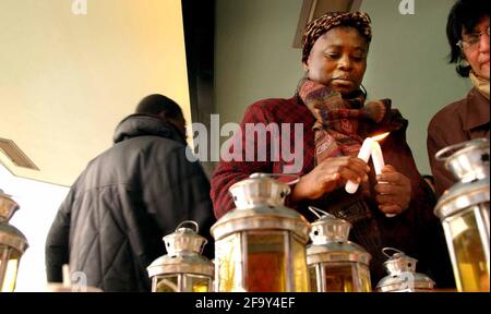 THE MOTHER OF VICTORIA CLIMBIE LIGHTS A CANDLE AT A VIGIL TO MARK THE ...