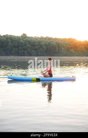 A beautiful woman practicing paddle on a beautiful sunny day Stock ...