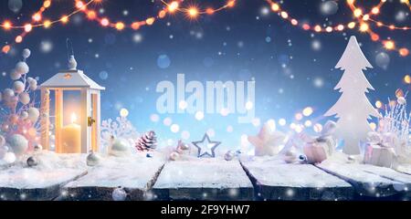 Christmas lantern on a wooden table with decorations. New Year card ...