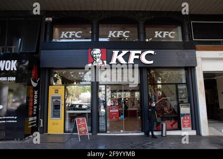 Athens, Greece. 21st Apr, 2021. People walking past a KFC Fast Food ...