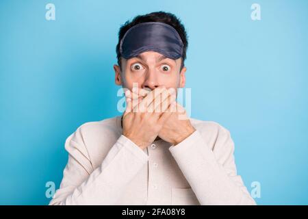 Portrait of nice worried guy closing mouth looking aside copy empty ...