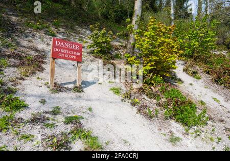 DANGER Slippery Slope sign Stock Photo - Alamy