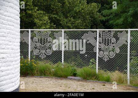 White Crochet in a fence Stock Photo - Alamy