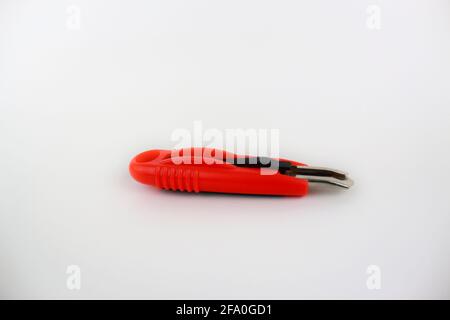 A red cutter isolated on white background Stock Photo - Alamy