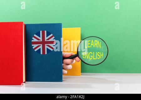 English or Spanish Concept. Magnifying glass and arrows on a white ...