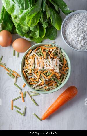 Delicious fresh noodles with sweet pepper, tomato, spices and herbs ...