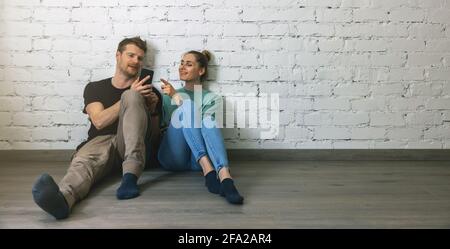 A young man of choose and buy the furniture Stock Photo - Alamy