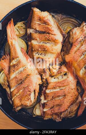 Fried sea bass fish. ish lunch meal cooking cuisine Stock Photo - Alamy