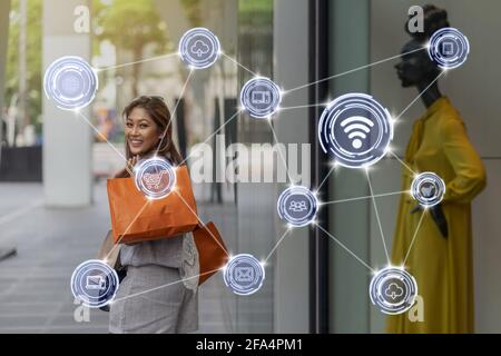 Asian Woman looking through virtual reality device at home. Augmented ...