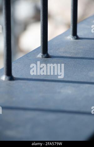 the texture of the metal railing up close. Close-up steel railing ...